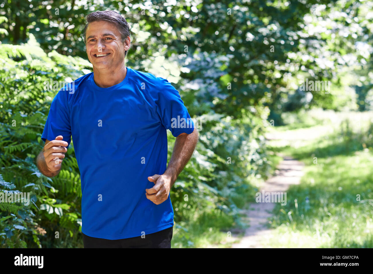 Mature athlete running in hi-res stock photography and images - Alamy