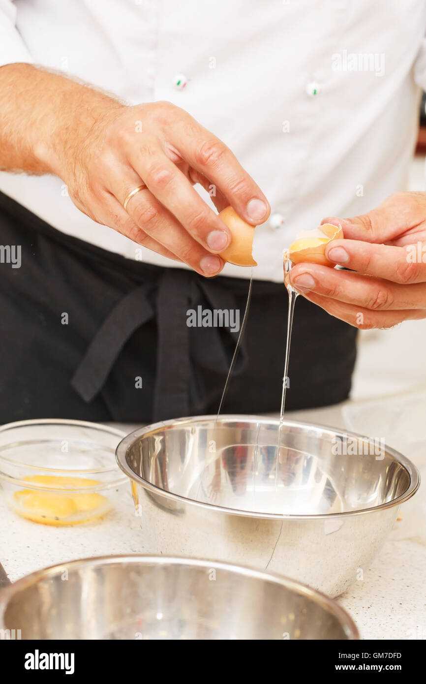 break an egg by dish Stock Photo - Alamy