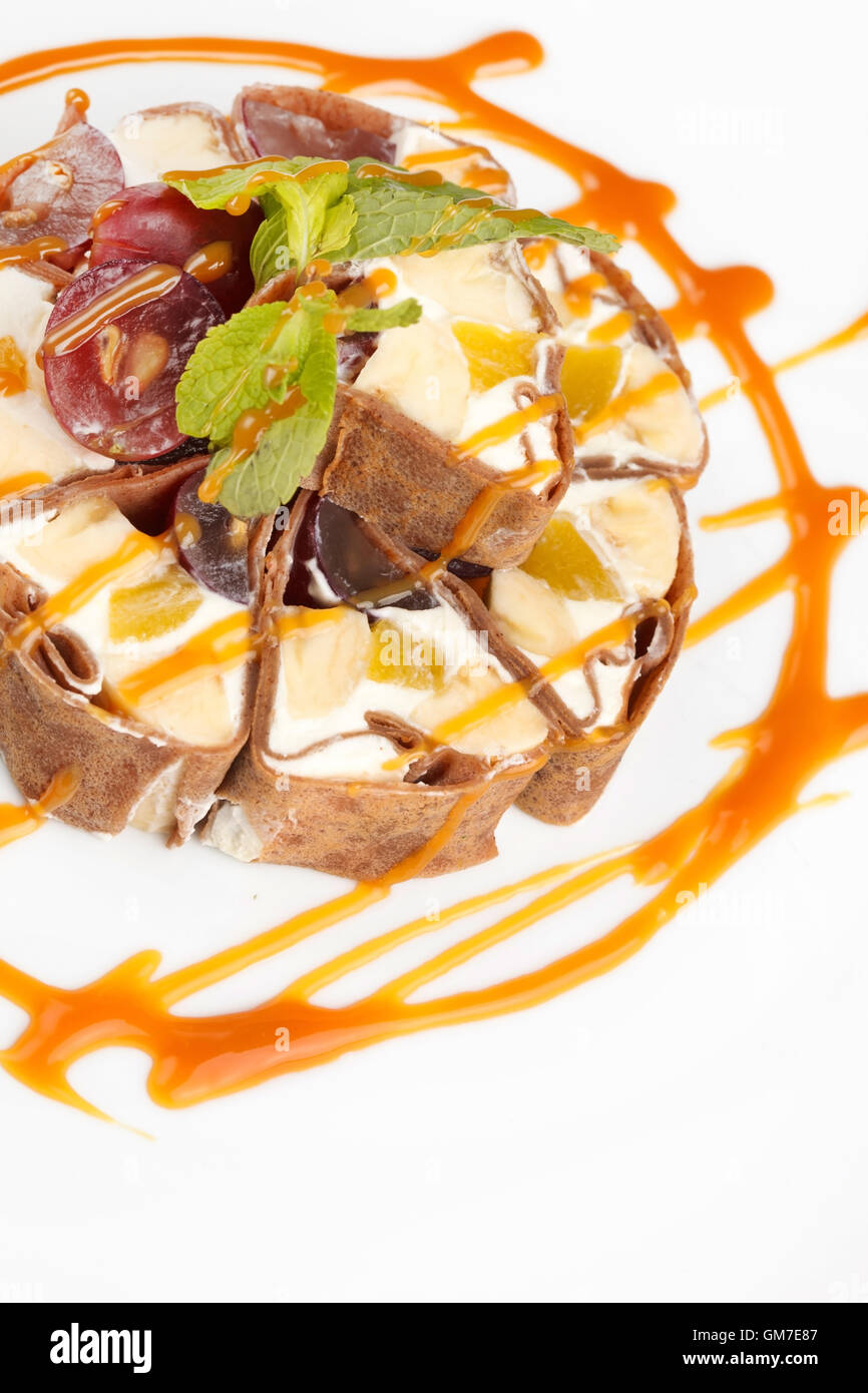 Tiramisu Sushi Roll garnished with Grapes and Mint Stock Photo - Alamy