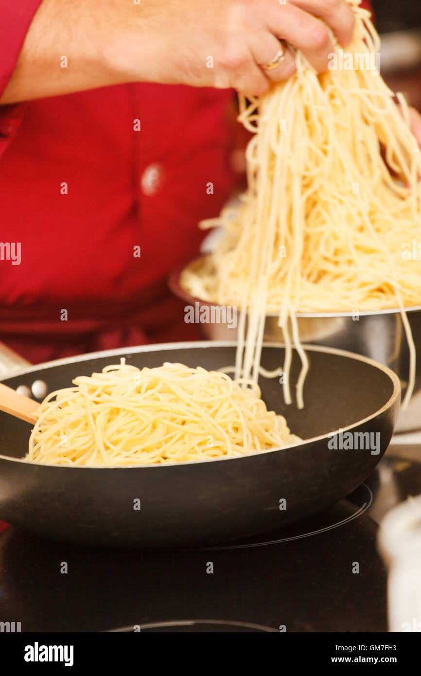 Chef preparing pasta Stock Photo - Alamy