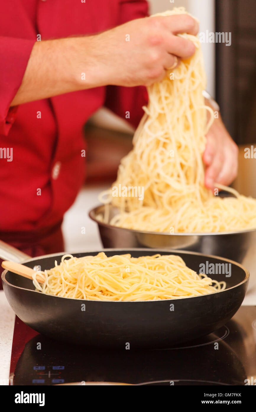 Chef preparing pasta Stock Photo - Alamy
