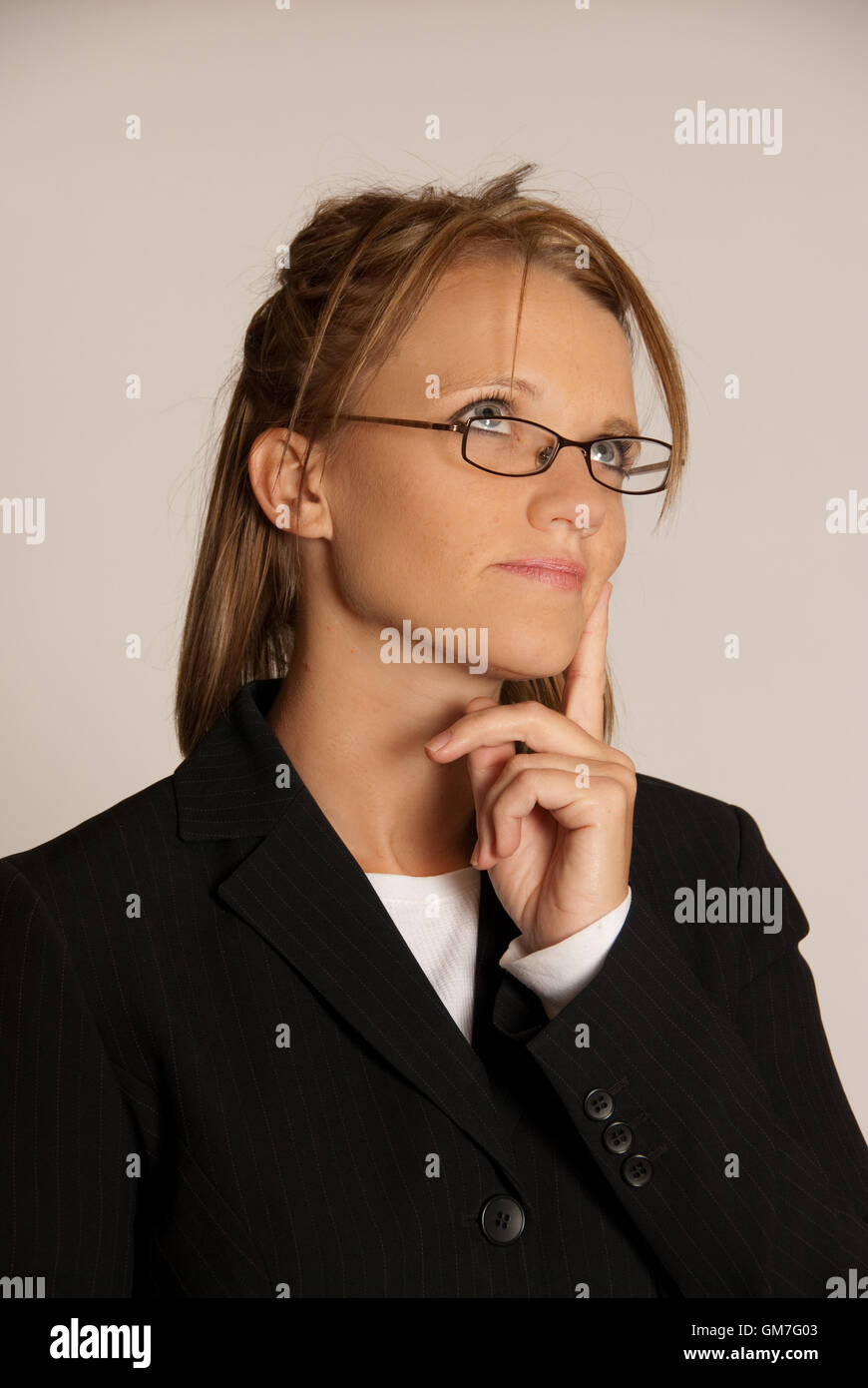 Business woman thinking Stock Photo - Alamy