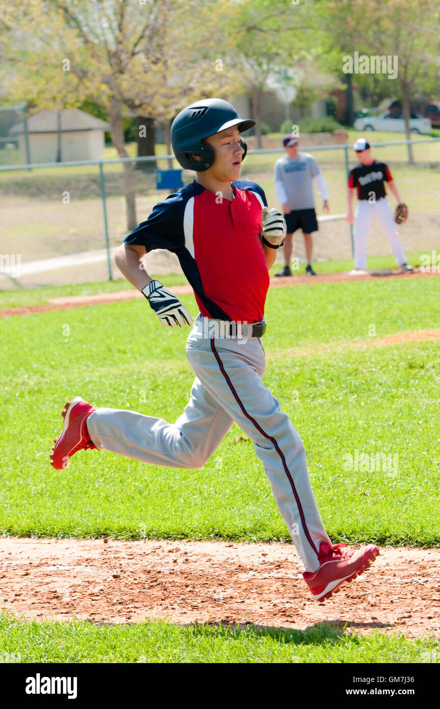 Teen baseball boy running Stock Photo - Alamy