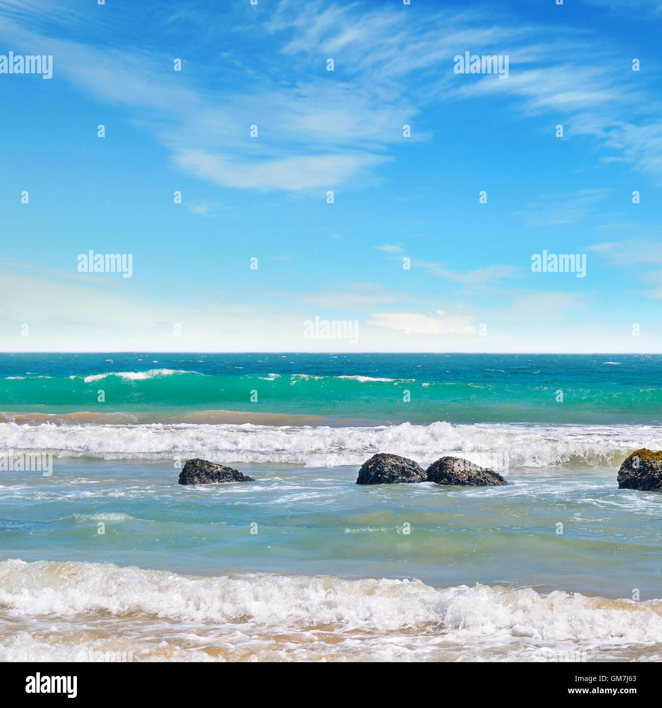ocean, picturesque beach and blue sky Stock Photo - Alamy
