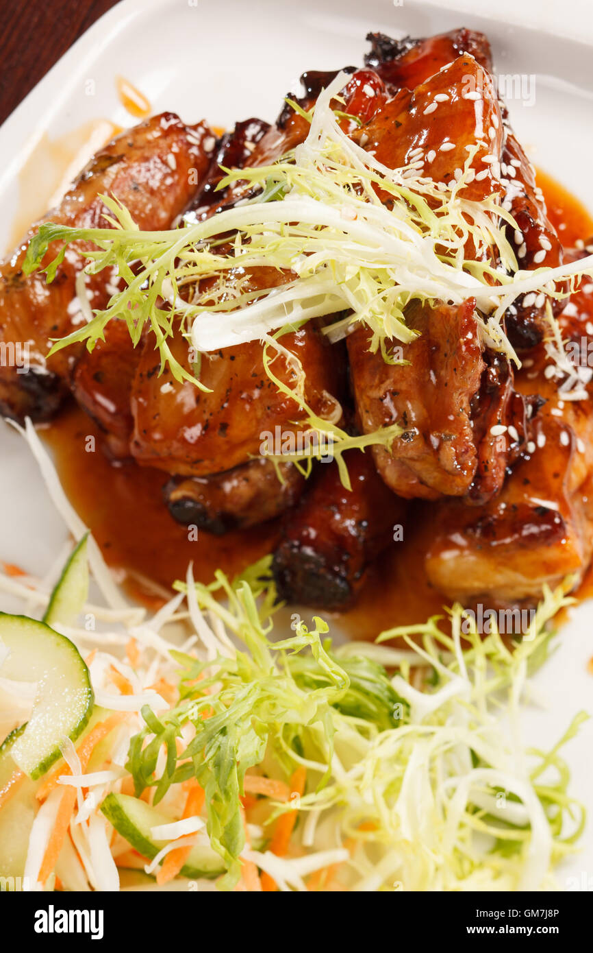 grilled ribs with salad Stock Photo - Alamy