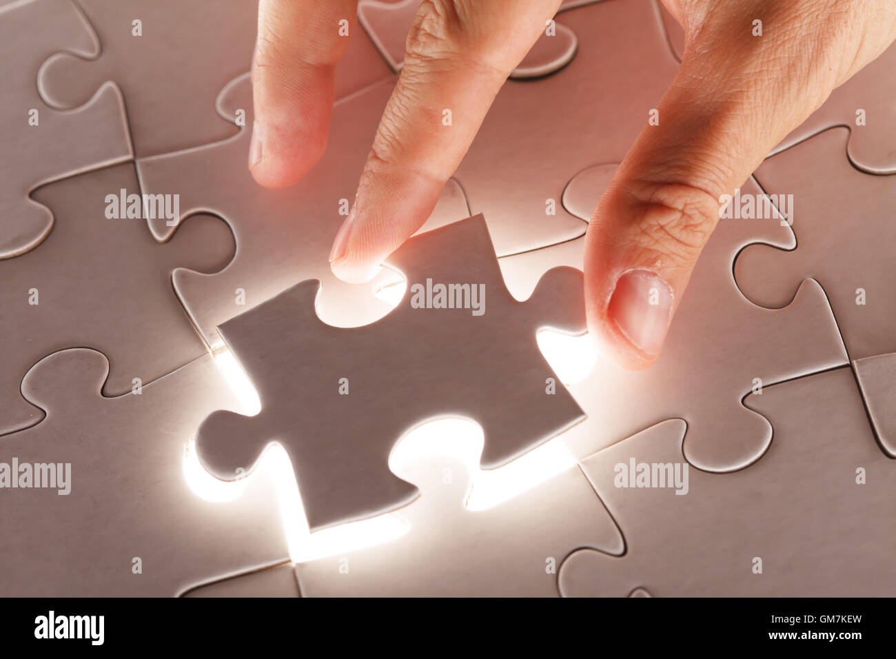 hand holding puzzle piece Stock Photo - Alamy