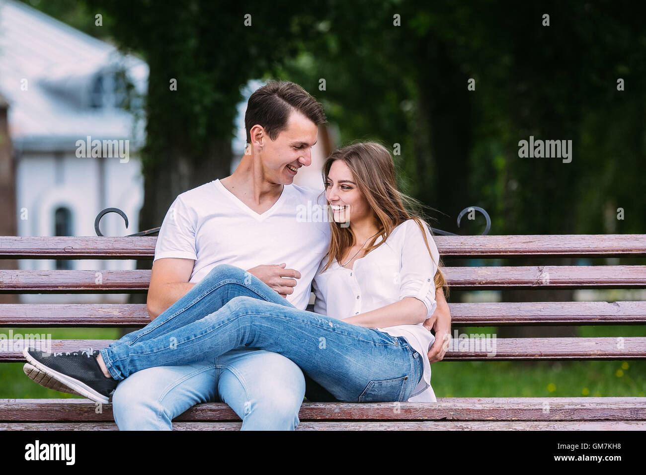 man and woman on a bench in the park Stock Photo - Alamy