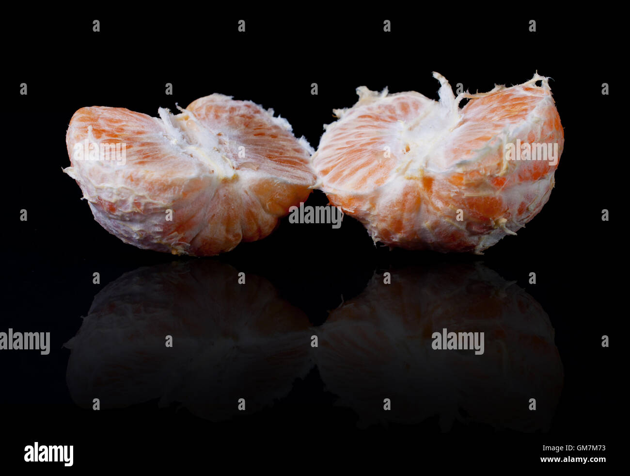 Halves of peeled tangerine Stock Photo - Alamy