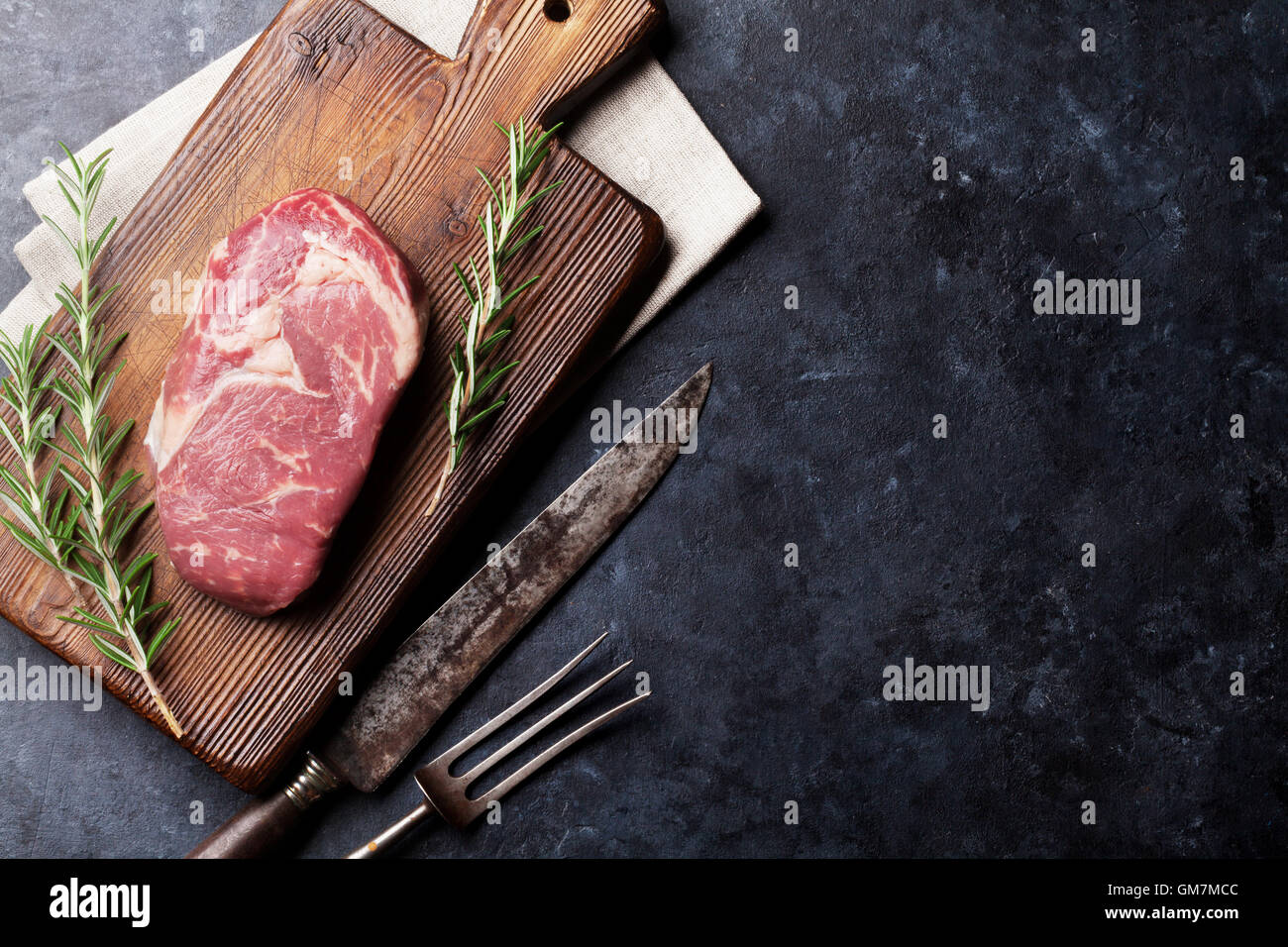 Raw beef steak cooking and ingredients. Top view with copy space over ...