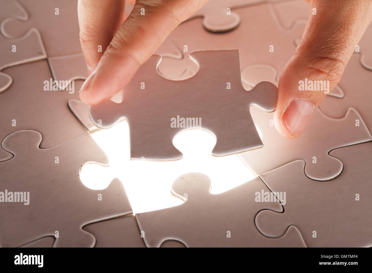 hand holding puzzle piece Stock Photo - Alamy