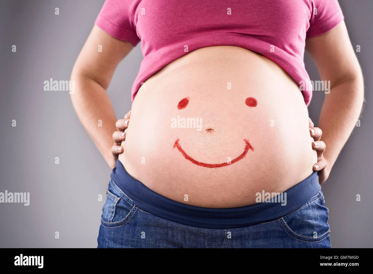 smile on belly Stock Photo - Alamy