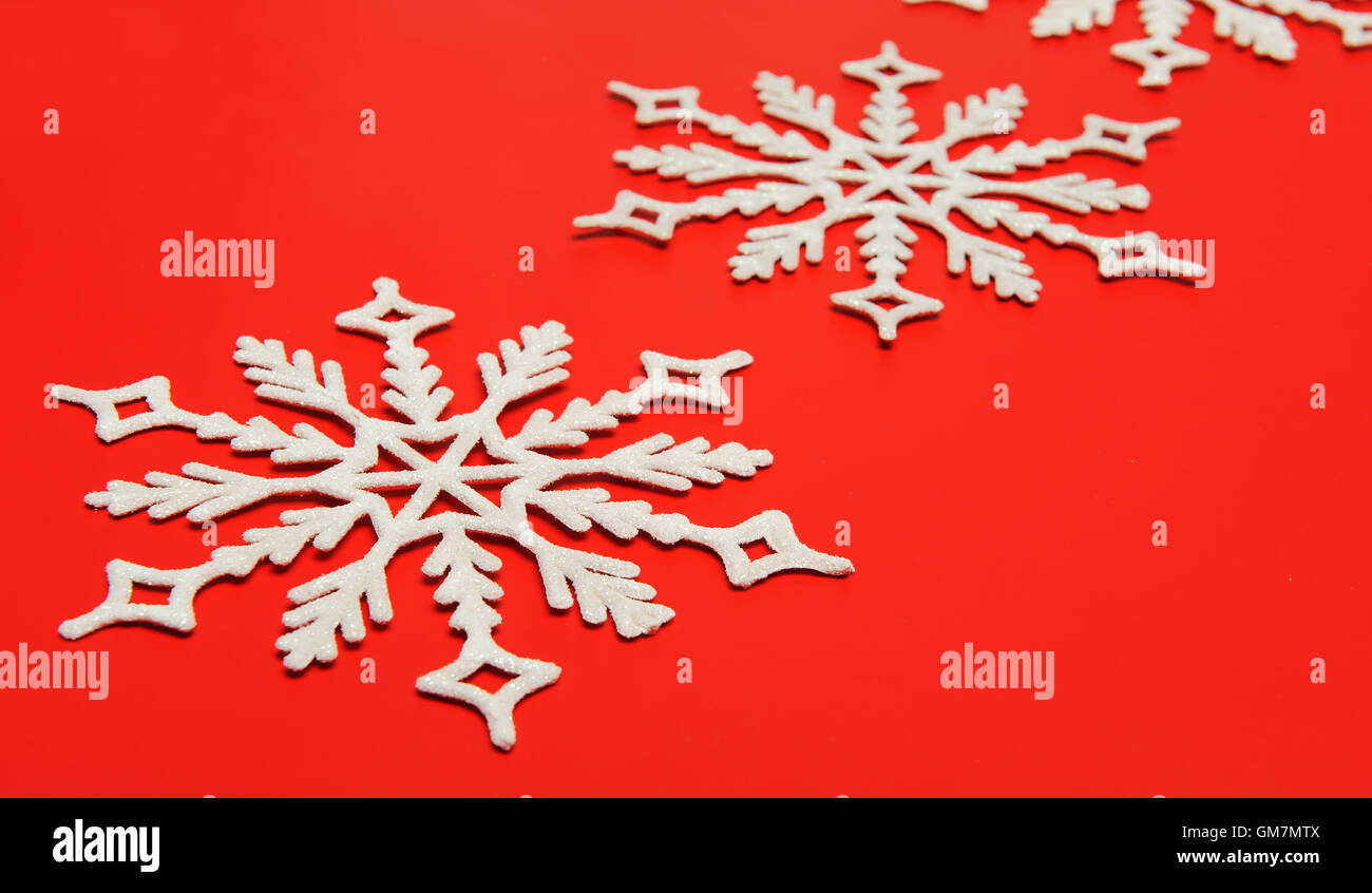 The big snowflake on a red background Stock Photo - Alamy