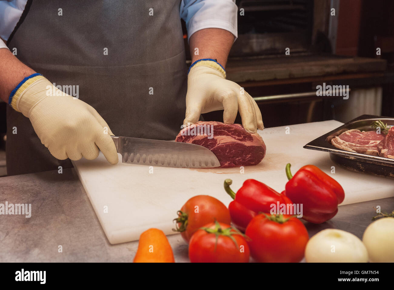 Chef cutting meat Stock Photo - Alamy