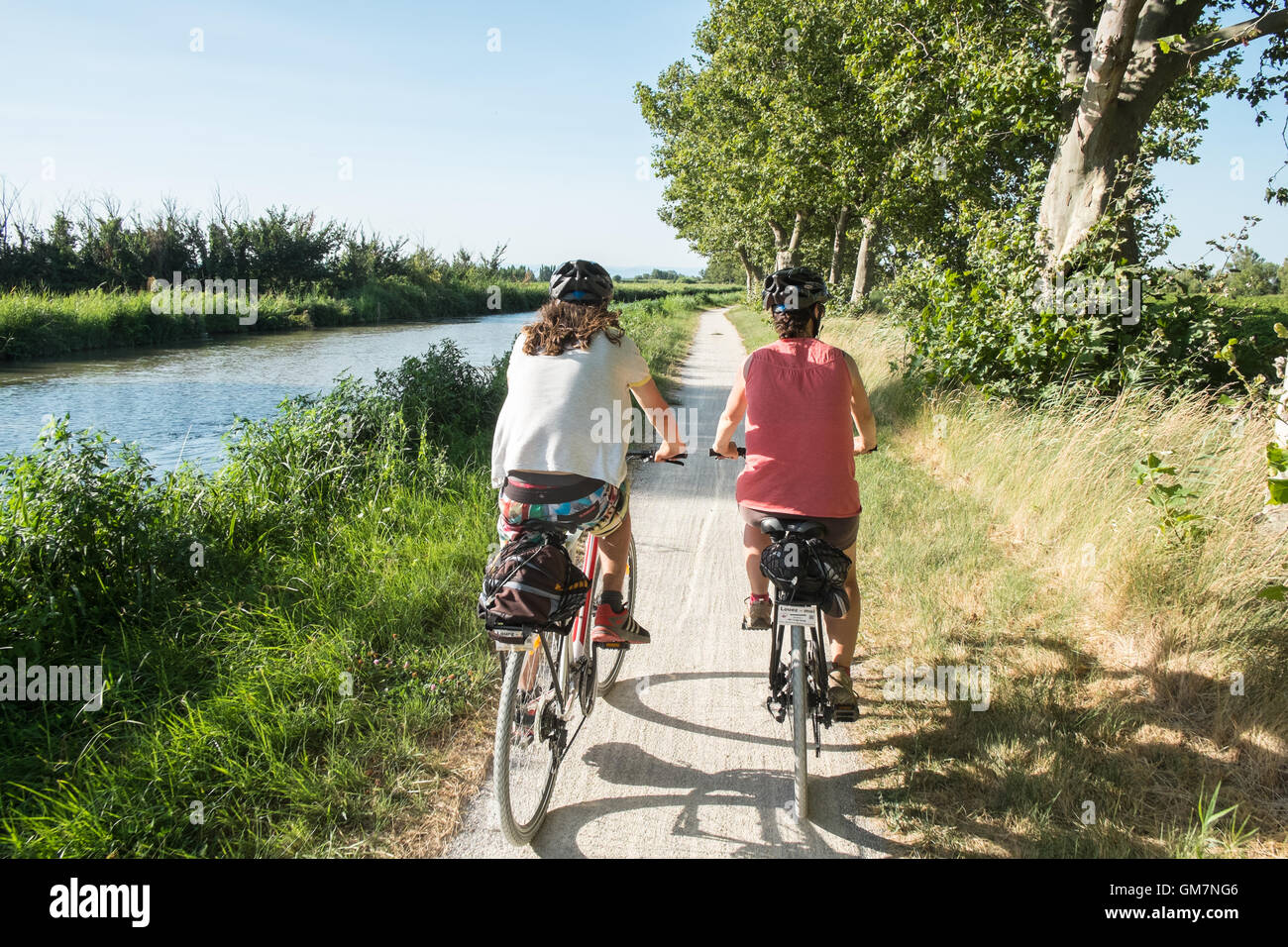 Riding,bike,bikes,by the sea.Cycling Canal de la Robine from Narbonne to the Mediterranean Sea ...