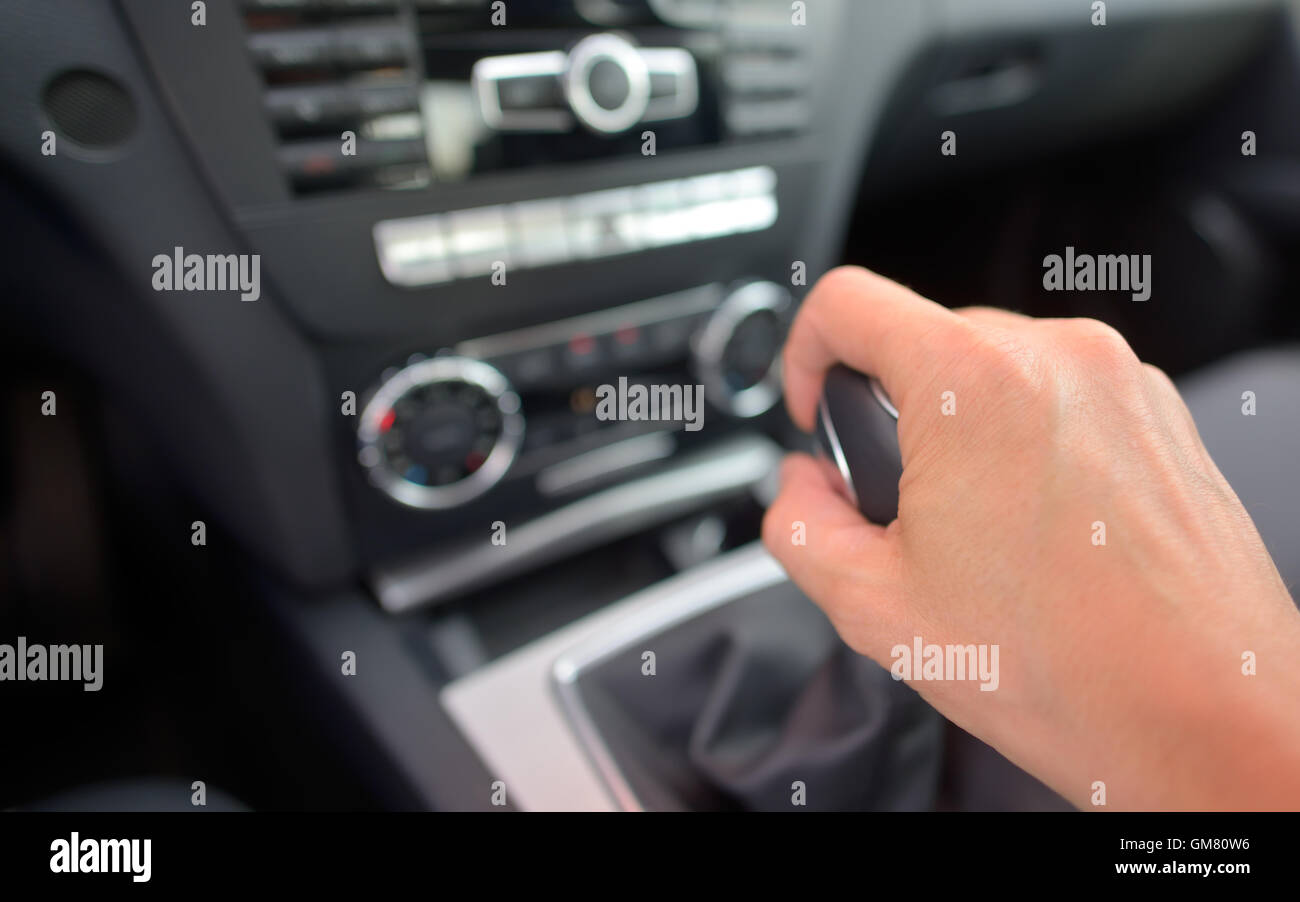 man driver hand shifting the gear stick Stock Photo - Alamy