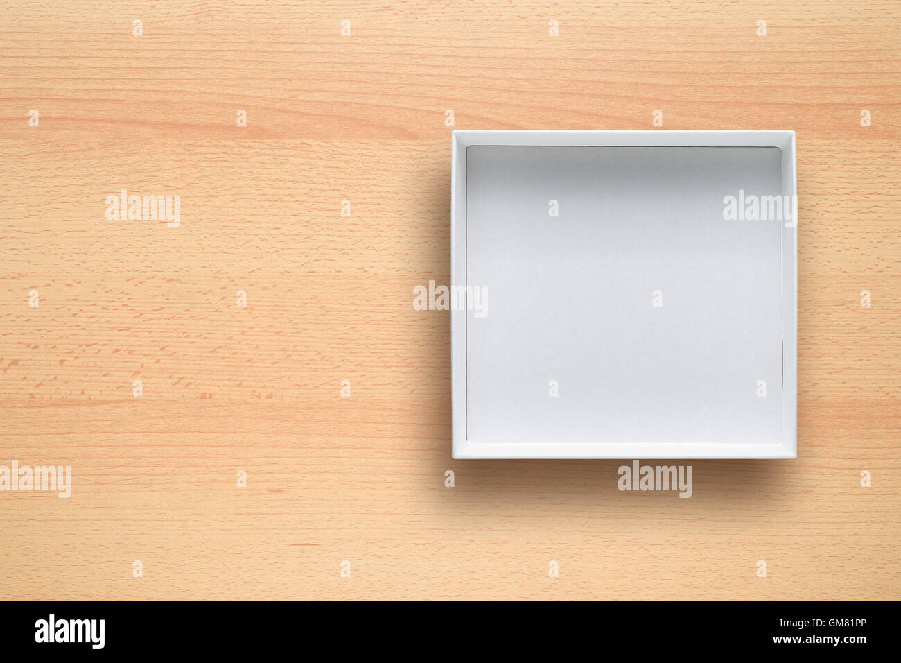 White cardboard box on desk top view Stock Photo - Alamy
