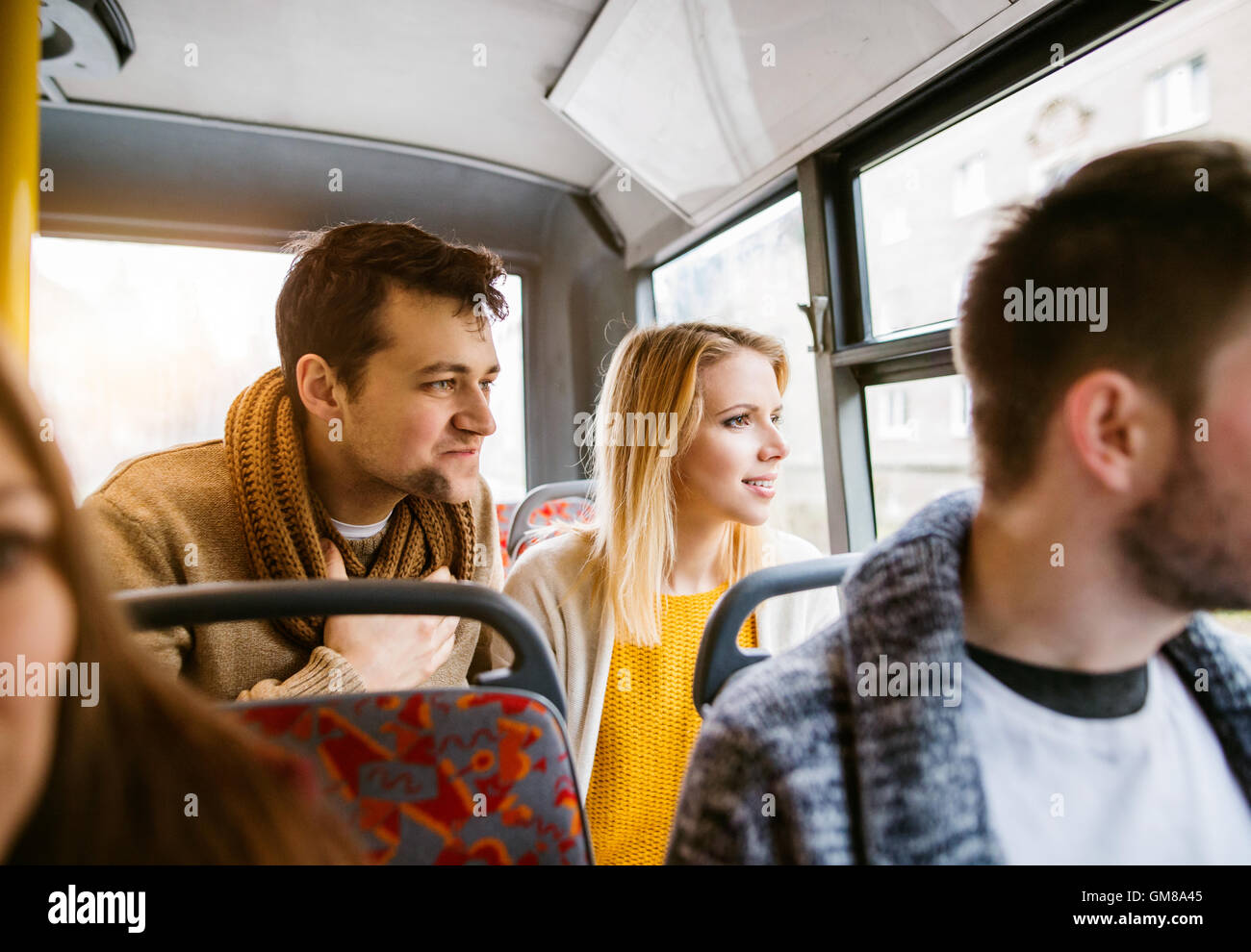 Group of young people traveling by bus, having fun Stock Photo - Alamy