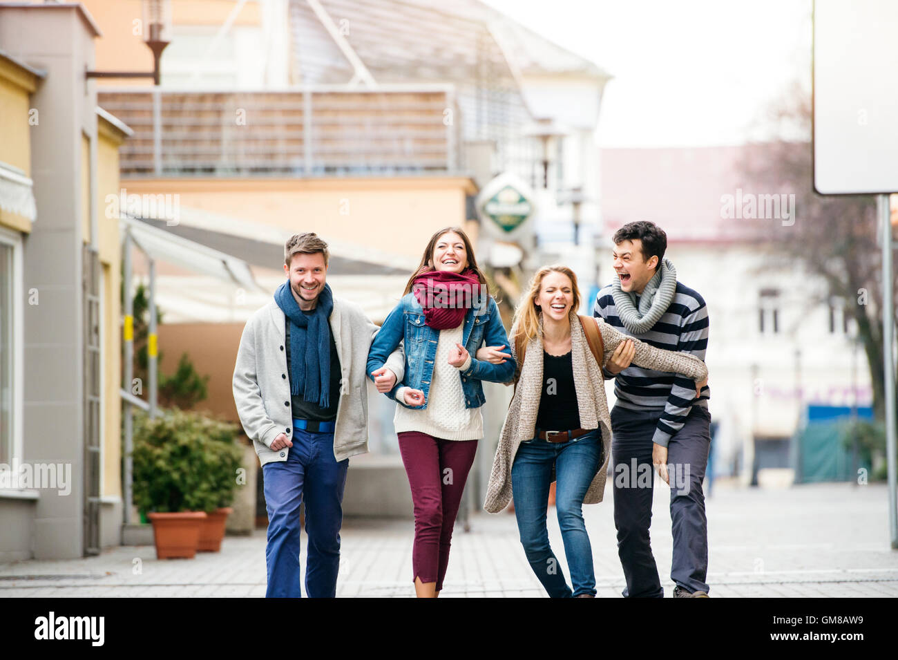 Group of young people having fun in town, laughing Stock Photo - Alamy