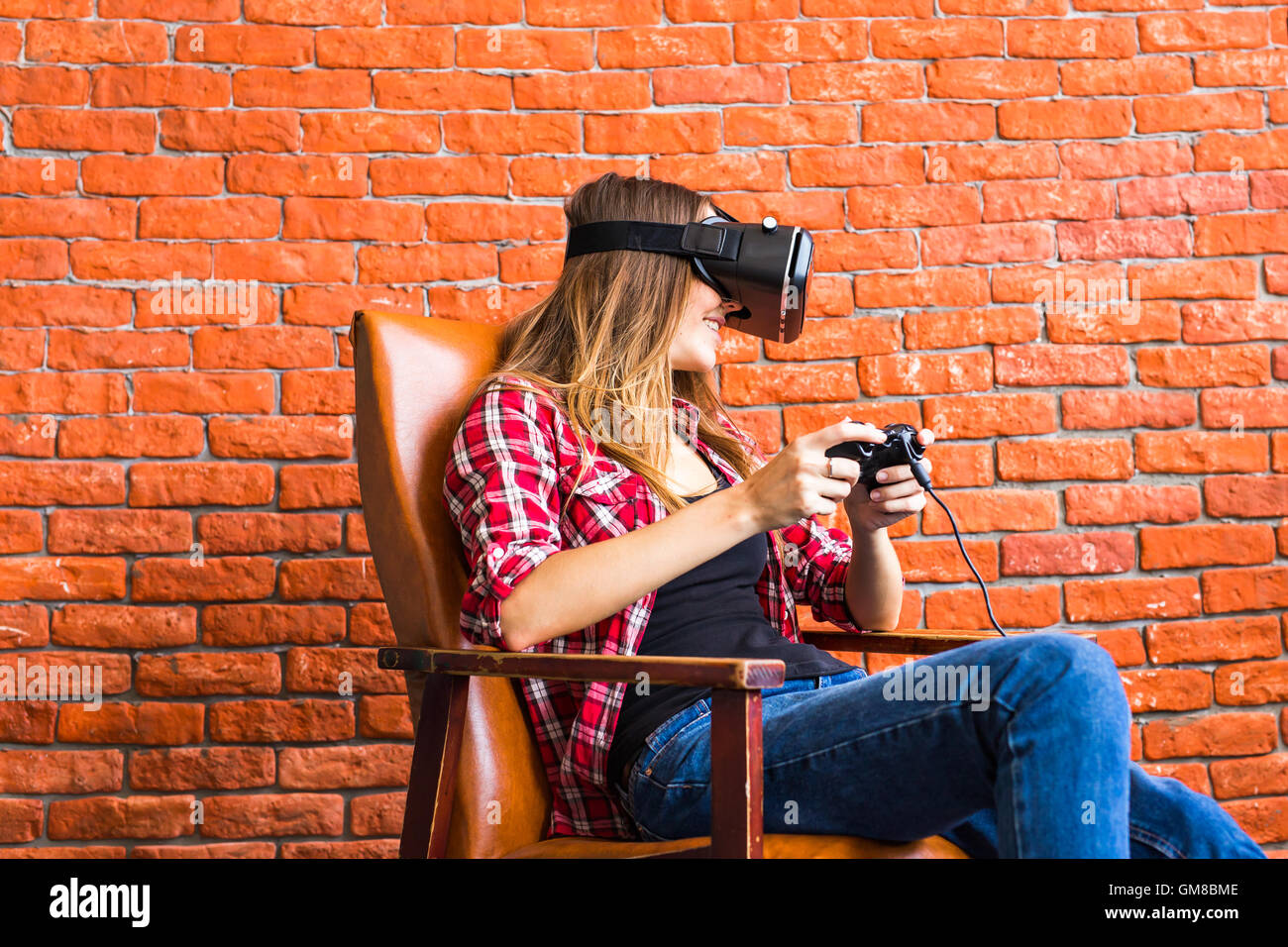 Woman play the video game with virtual reality device Stock Photo - Alamy