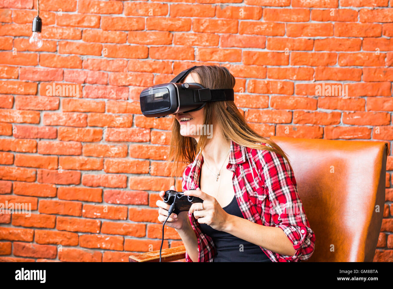 Woman play the video game with virtual reality device Stock Photo - Alamy