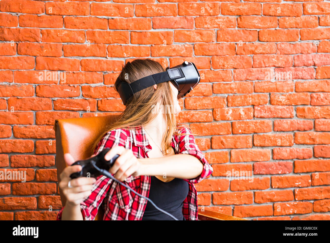 Woman play the video game with virtual reality device Stock Photo - Alamy