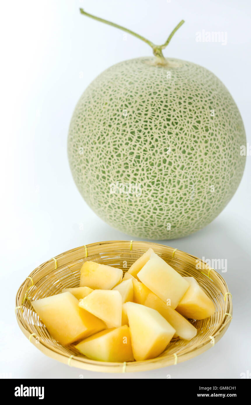 freshly cut cantaloupe melon on white background Stock Photo - Alamy