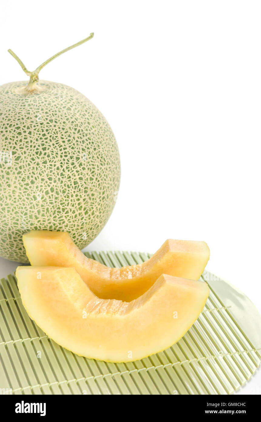 freshly cut cantaloupe melon on white background Stock Photo - Alamy