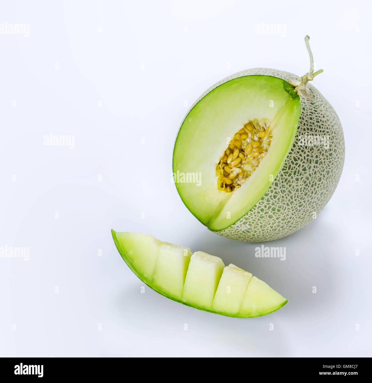 shopped green melon isolated on white background Stock Photo - Alamy