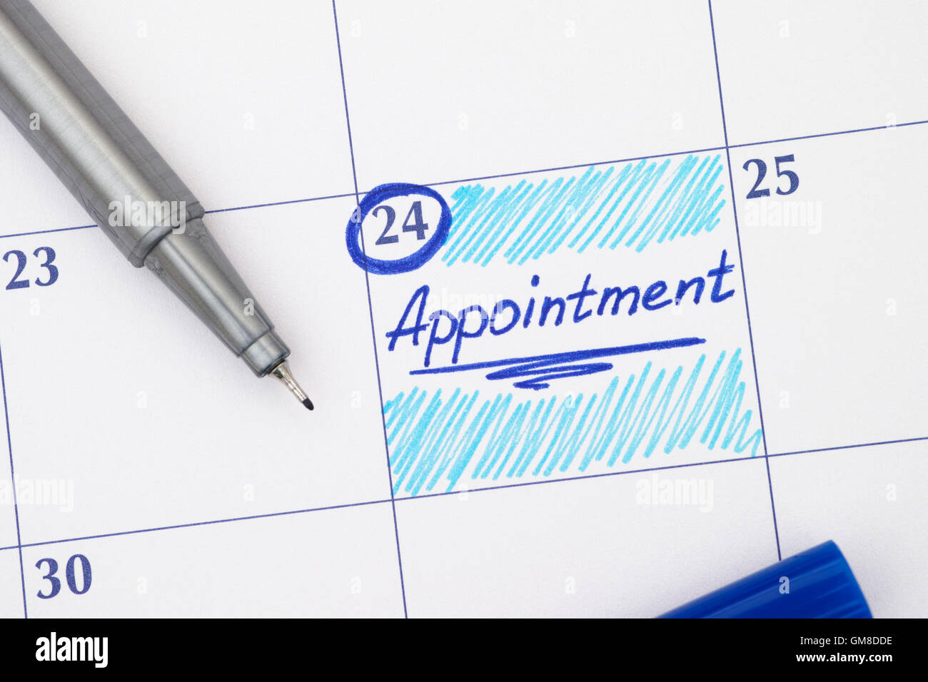 Reminder Appointment in calendar with blue pen Stock Photo - Alamy