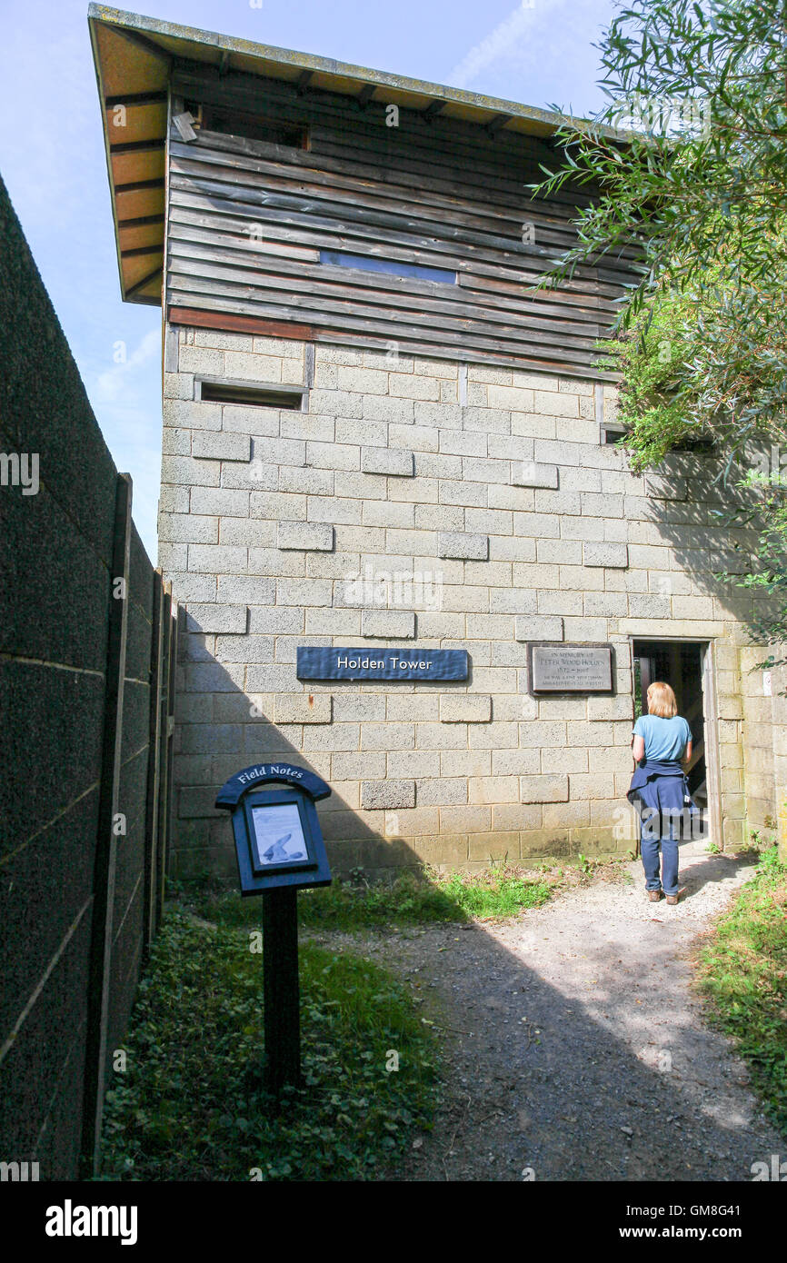 A woman entering the Holden Tower bird hide at Wildfowl and Wetlands ...