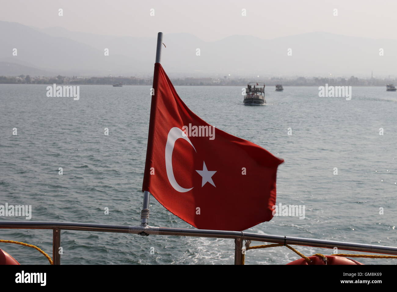 A turkish flag flying on the stern of a boat in turkey Stock Photo - Alamy