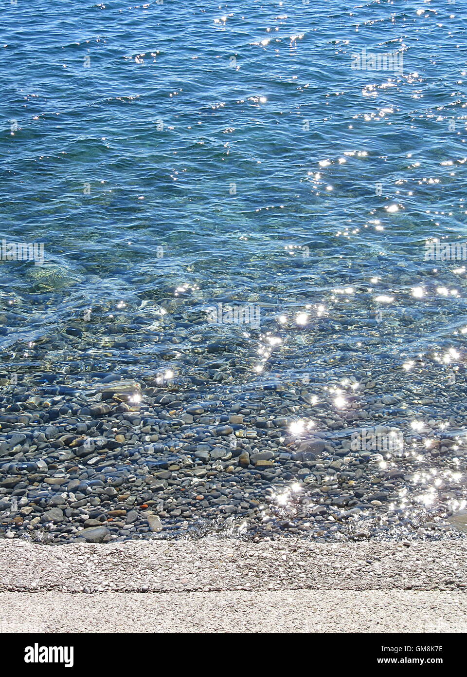 Close-up detail shot of sea waves and gravel shore Stock Photo - Alamy