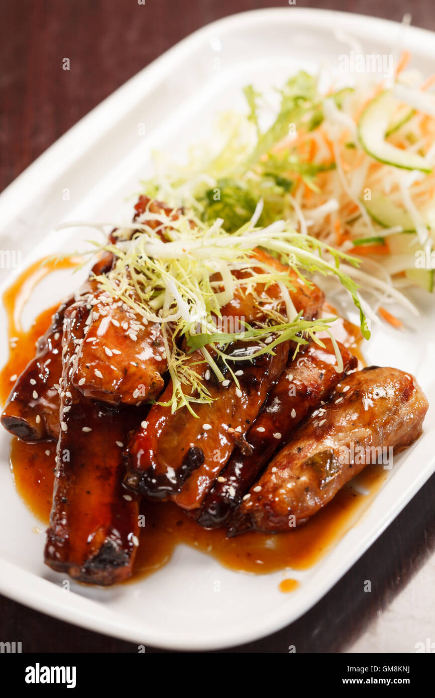 grilled ribs with salad Stock Photo - Alamy
