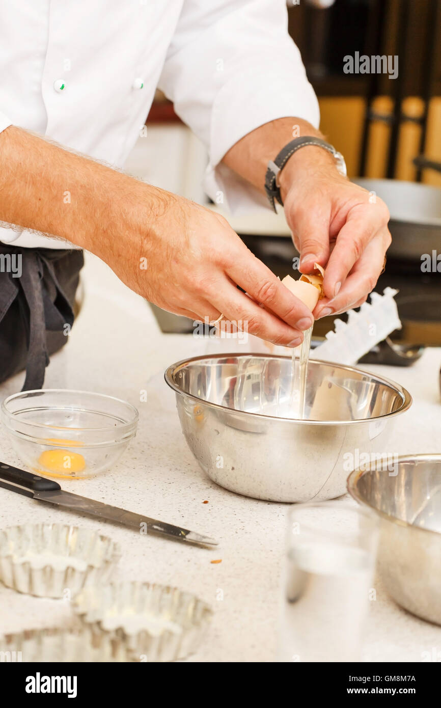 break an egg by dish Stock Photo - Alamy