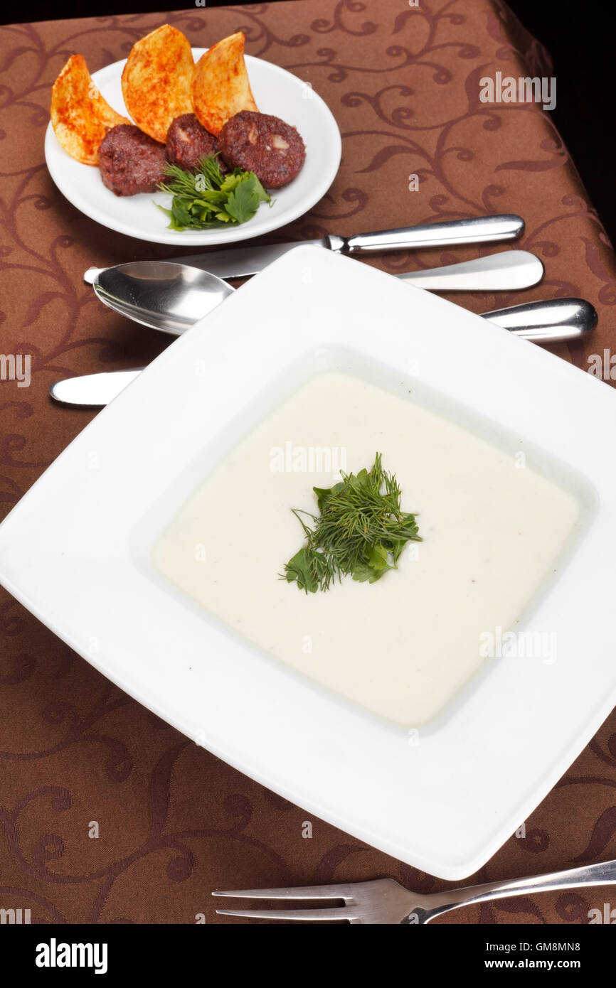 cream soup with potato chips and black pudding Stock Photo - Alamy