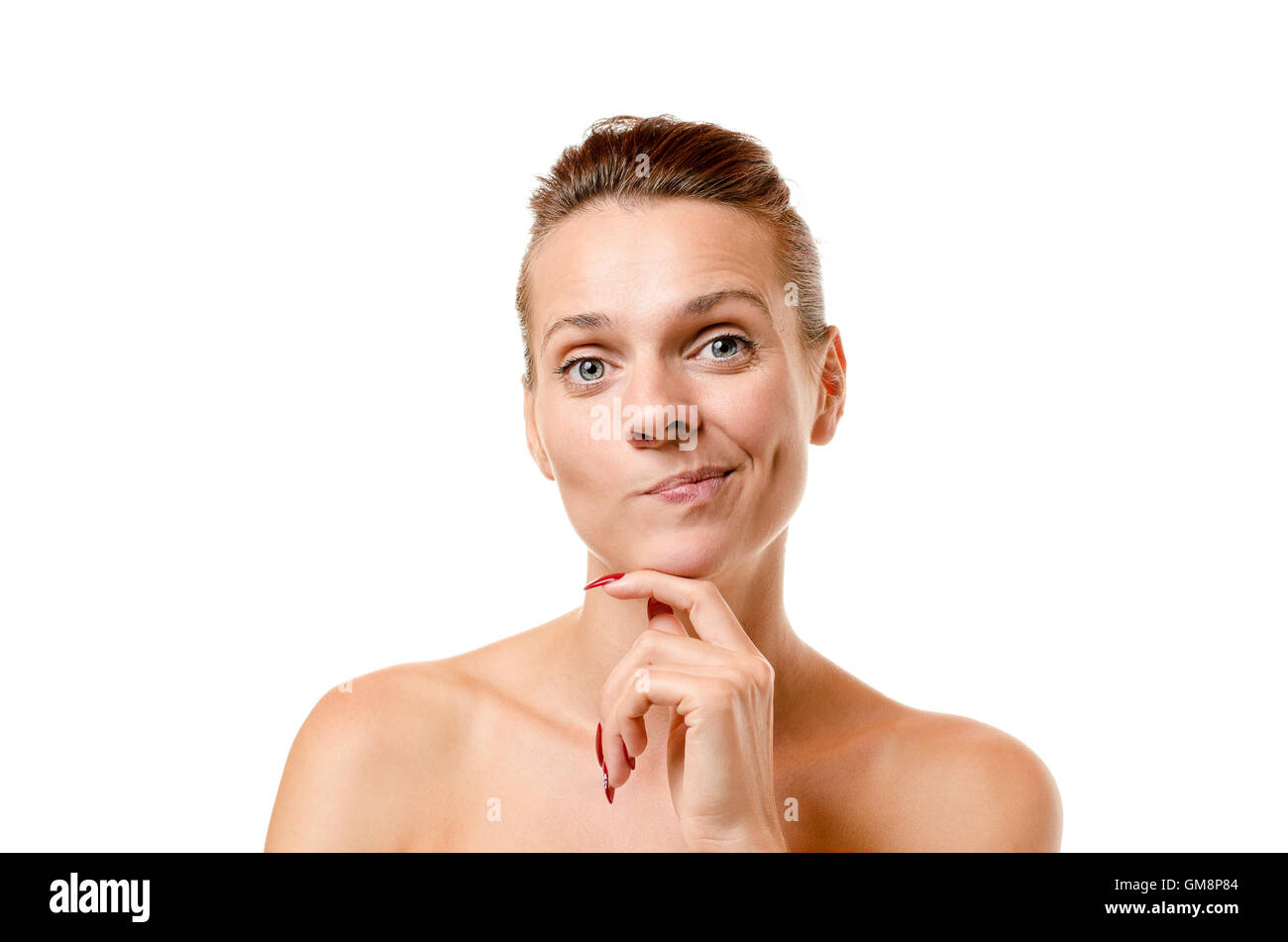 Cute thoughtful woman pulling a funny face grimacing with a wry ...