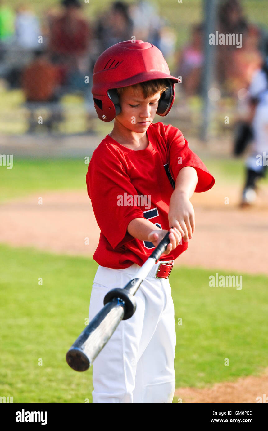 Boy warming up to bat Stock Photo - Alamy