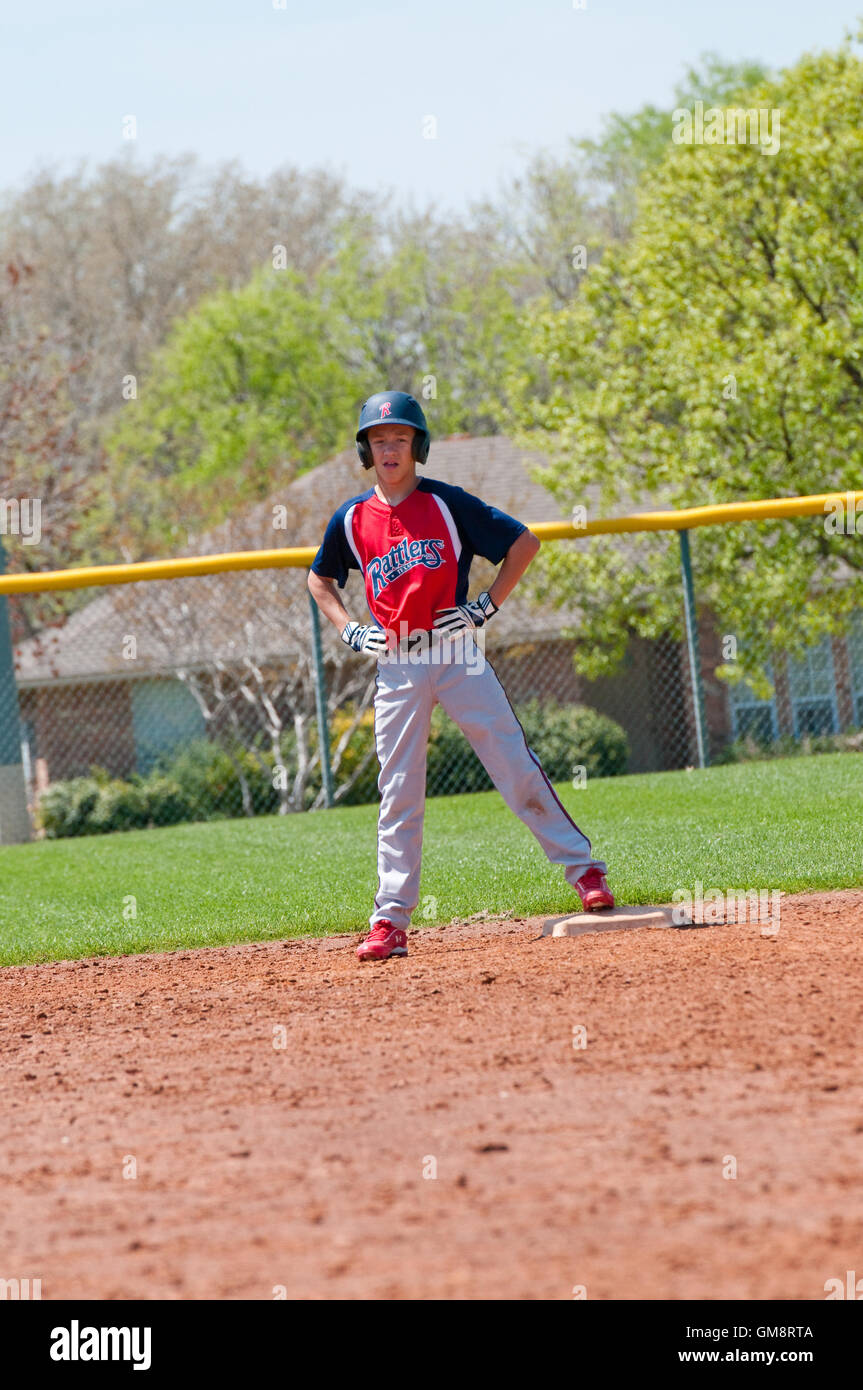 Teen baseball player on base Stock Photo - Alamy