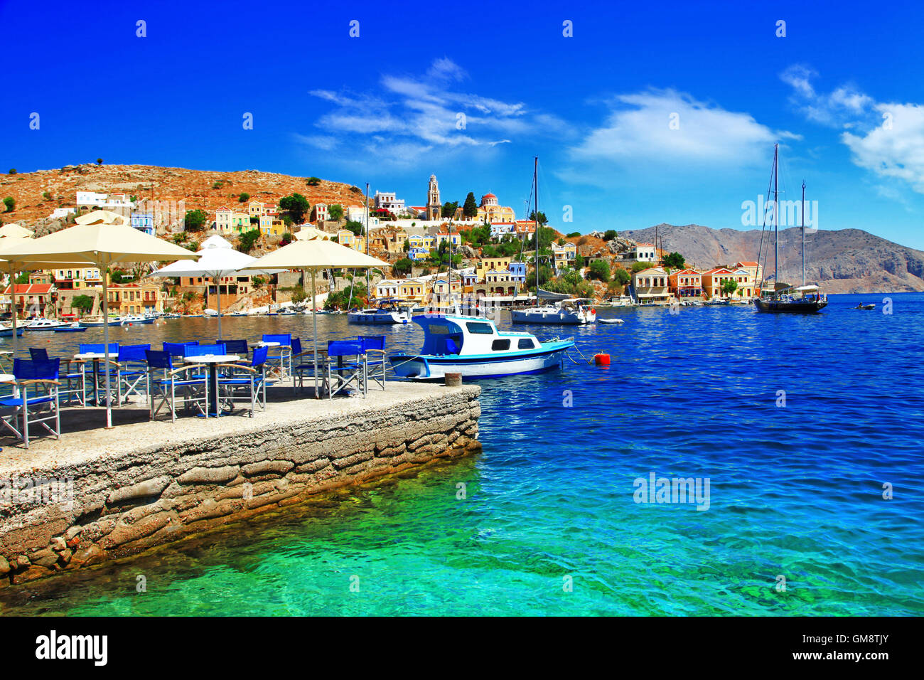 Beautiful Symi island,view with taverna and yacht,Greece Stock Photo ...