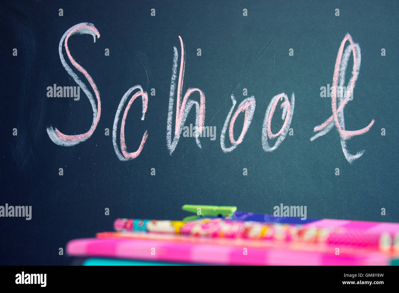 Back to school-chalkboard, notebooks and pencil Stock Photo - Alamy