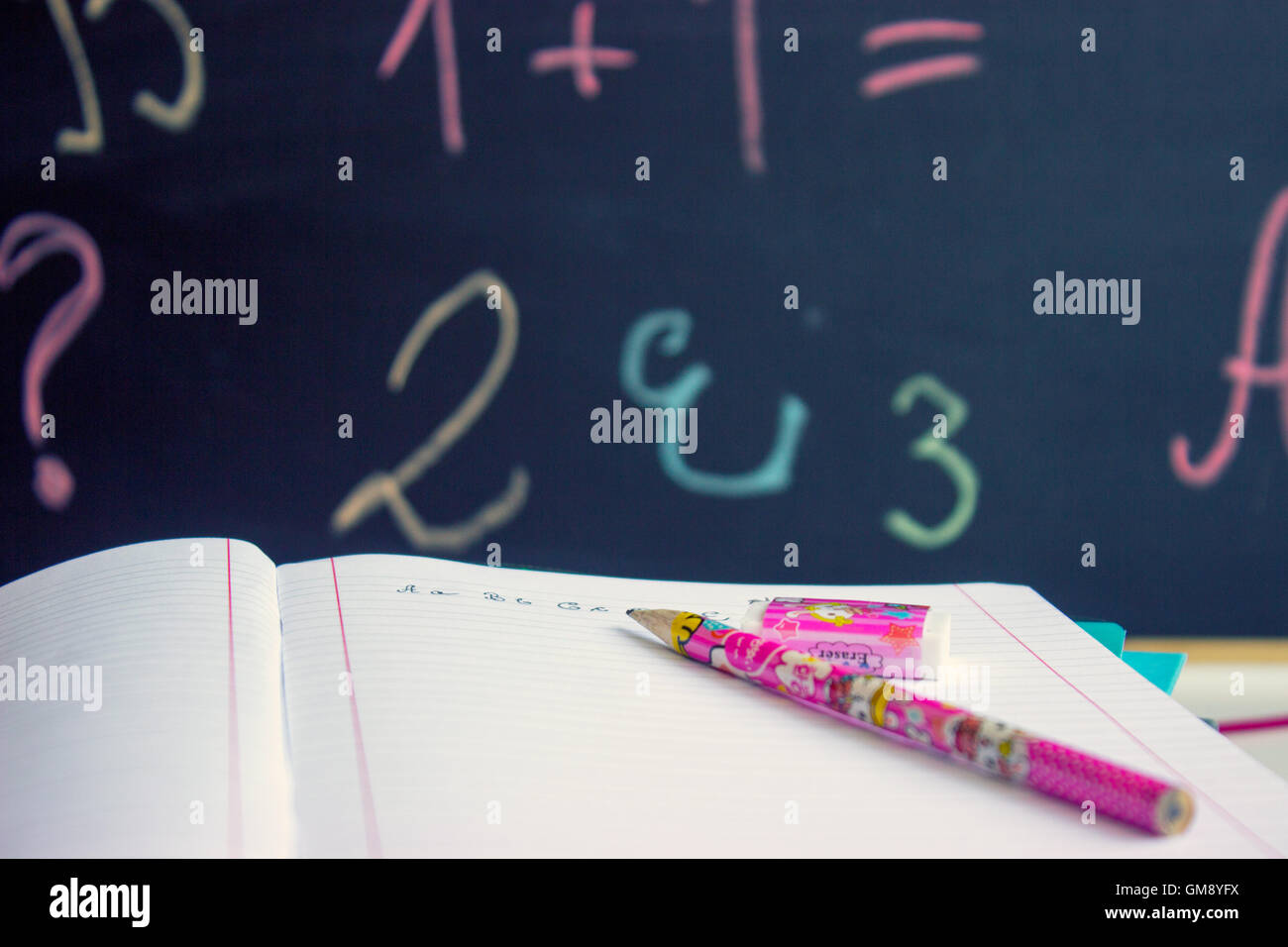 Back to school-chalkboard, notebooks and pencil Stock Photo - Alamy
