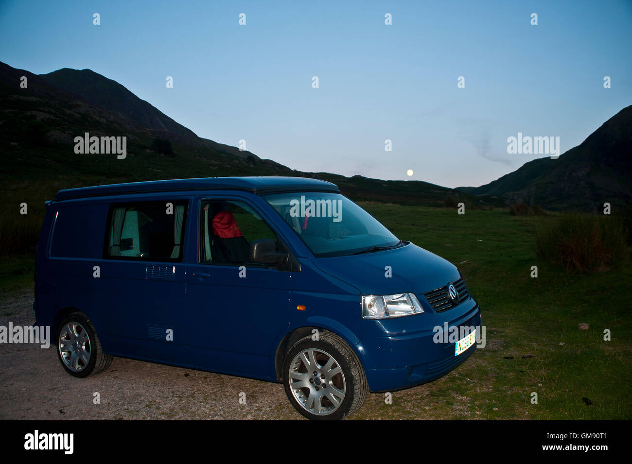 volkswagen camper van parked at buttermere at sunset with moon riding ...