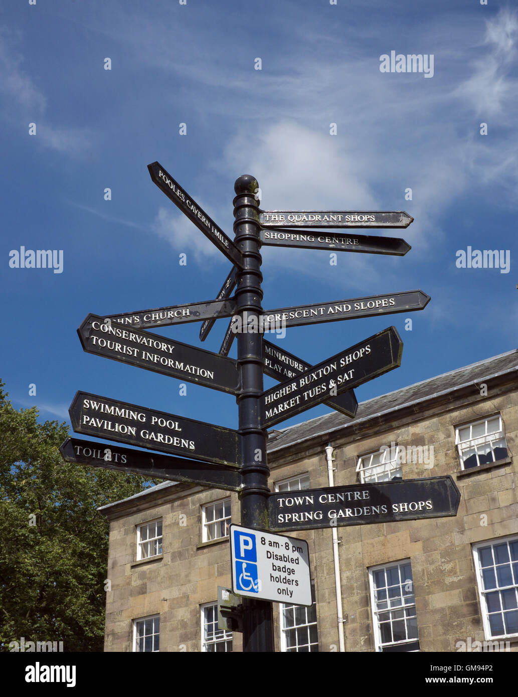 signpost indication the direction of several amenities in buxton ...