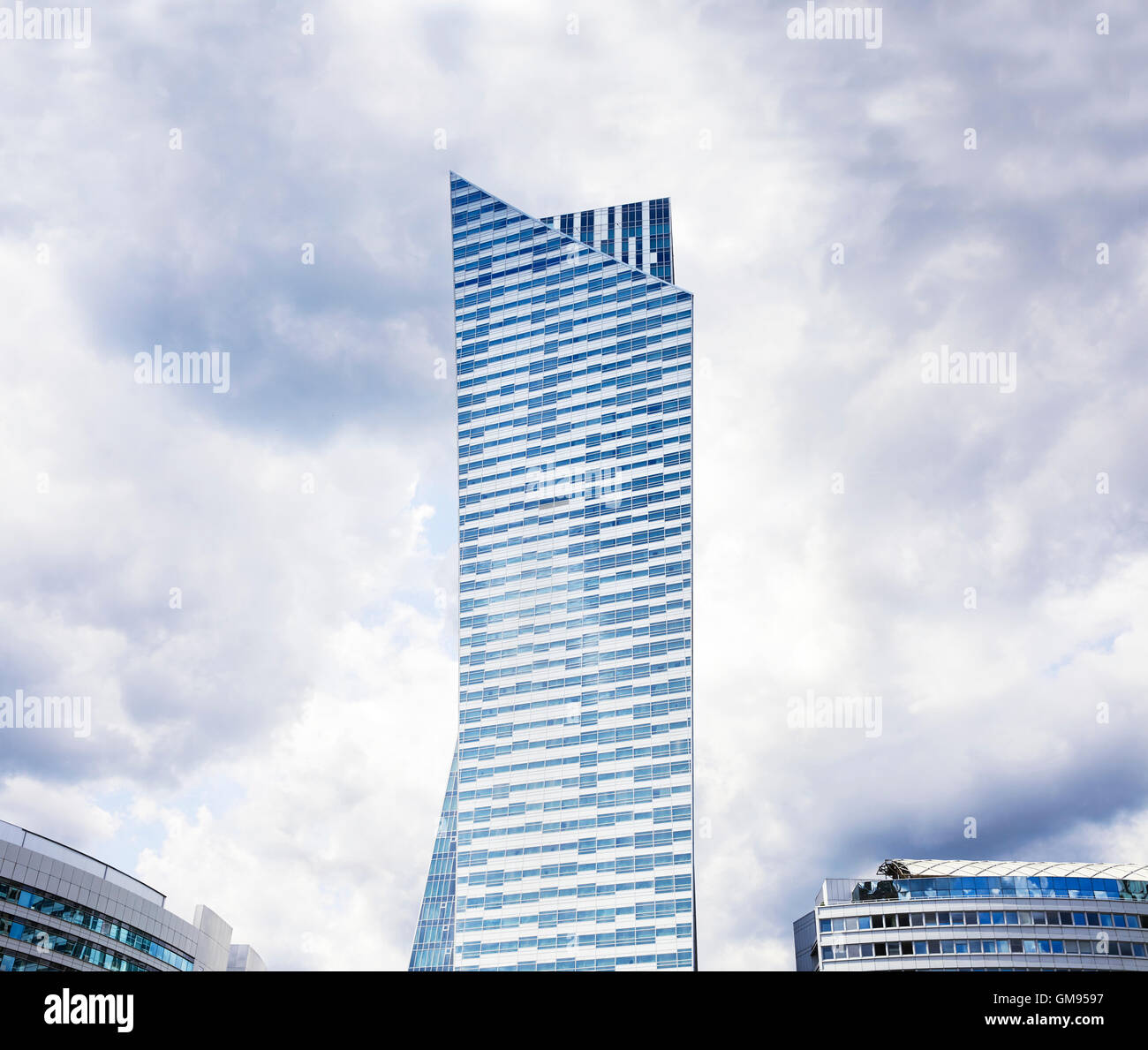 Modern residential skyscraper at cloudy sky. Copy space Stock Photo - Alamy