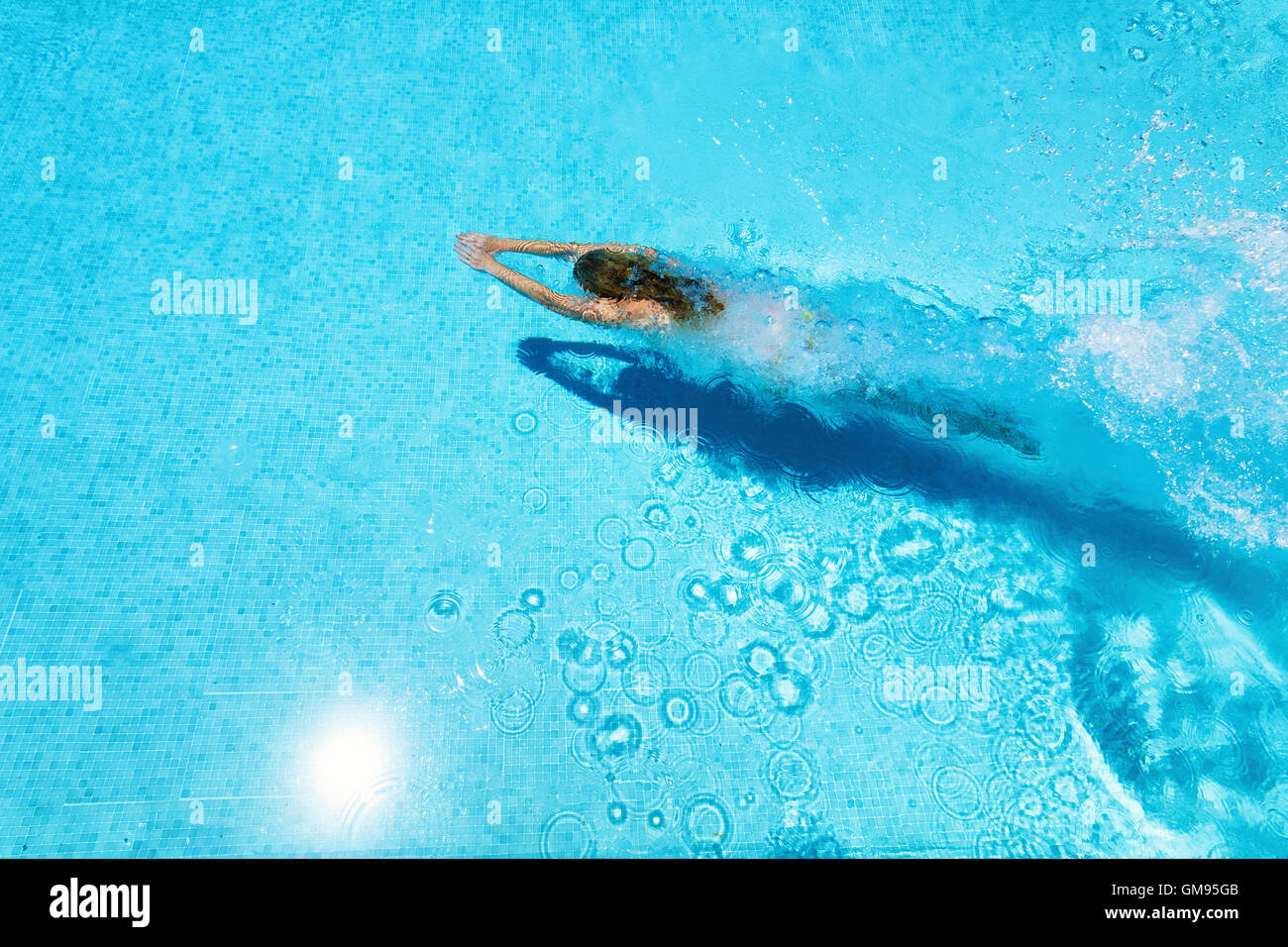 Woman diving underwater in swimming pool Stock Photo - Alamy
