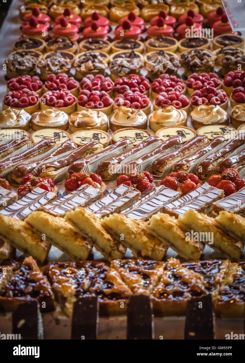Large assortment of mini cakes, muffins and pastries at Borough Market ...