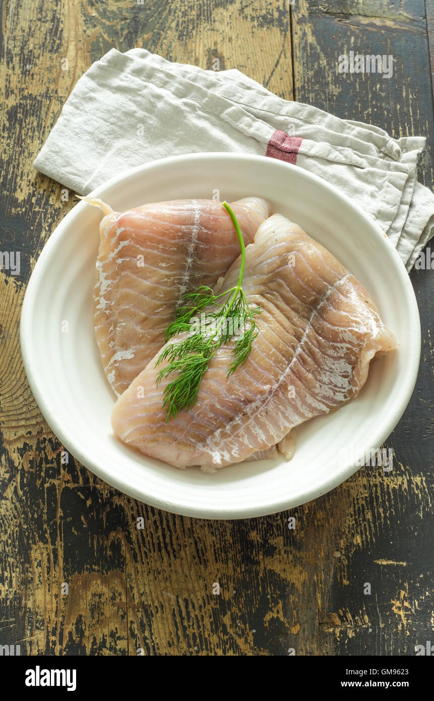 Fresh coalfish with dill on plate Stock Photo - Alamy