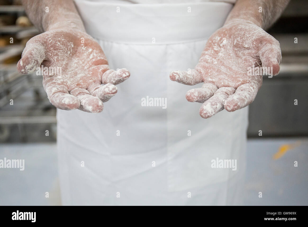 Hands of a baker with flour Stock Photo - Alamy