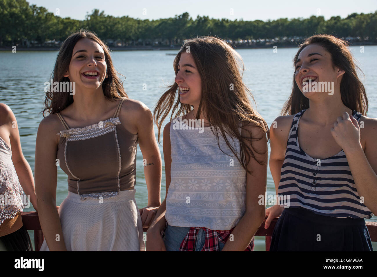 Laughing friends having fun together Stock Photo - Alamy