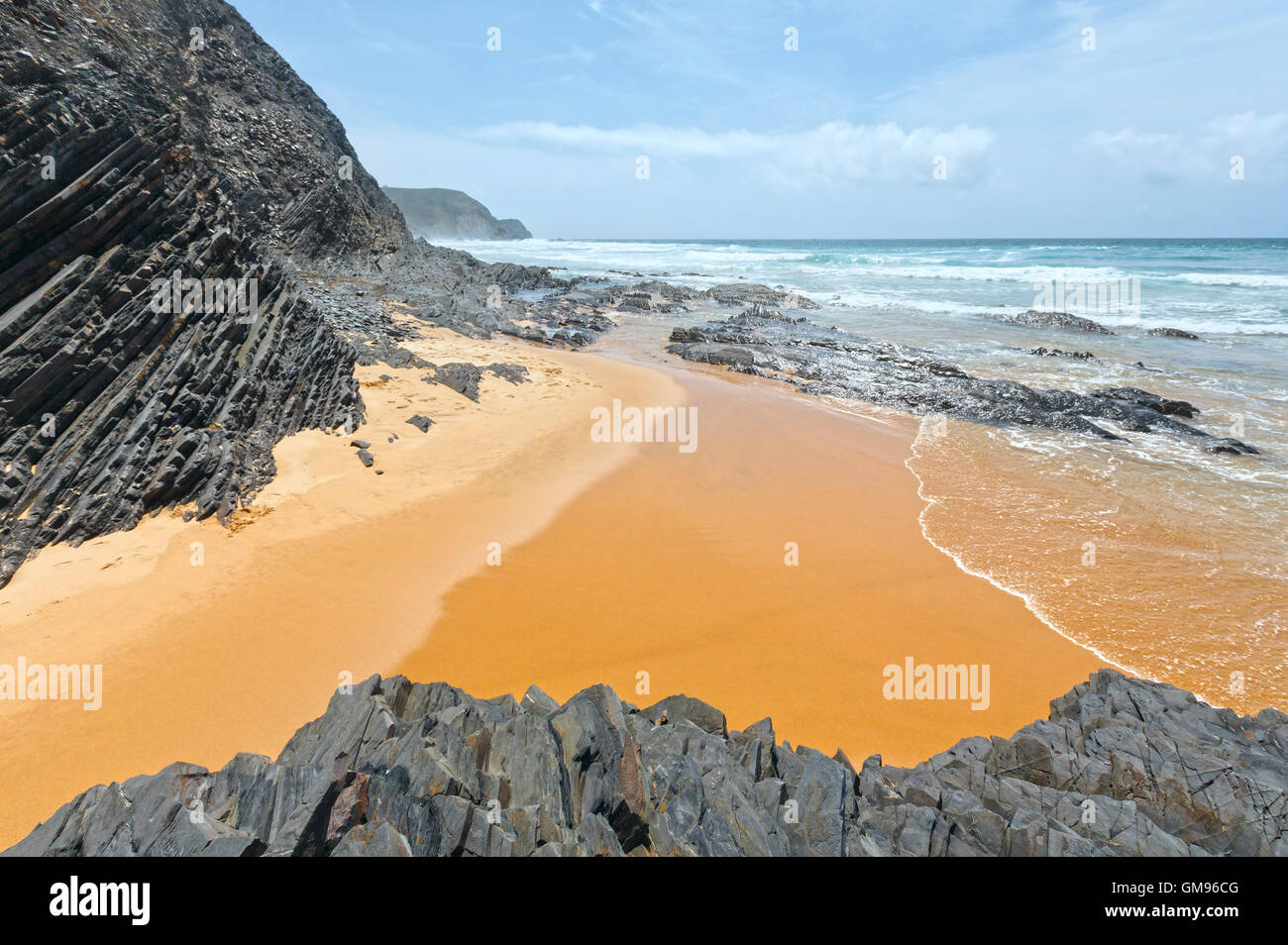 Atlantic ocean storm and Castelejo beach with black schist cliffs ...